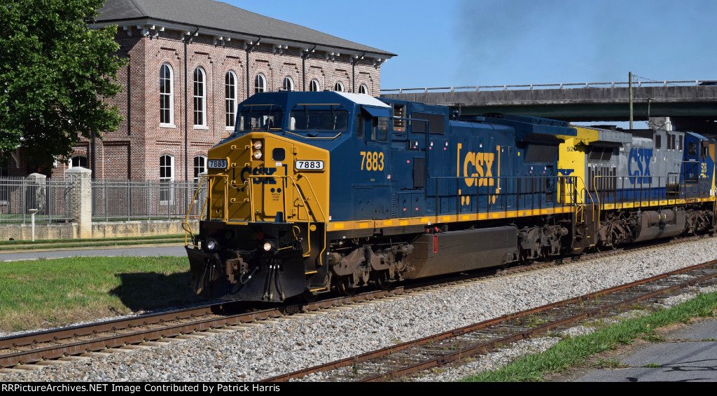 CSX 7893 in the YN3b scheme leads a 7-unit engine-slug consist through Cartersville GA on the ...